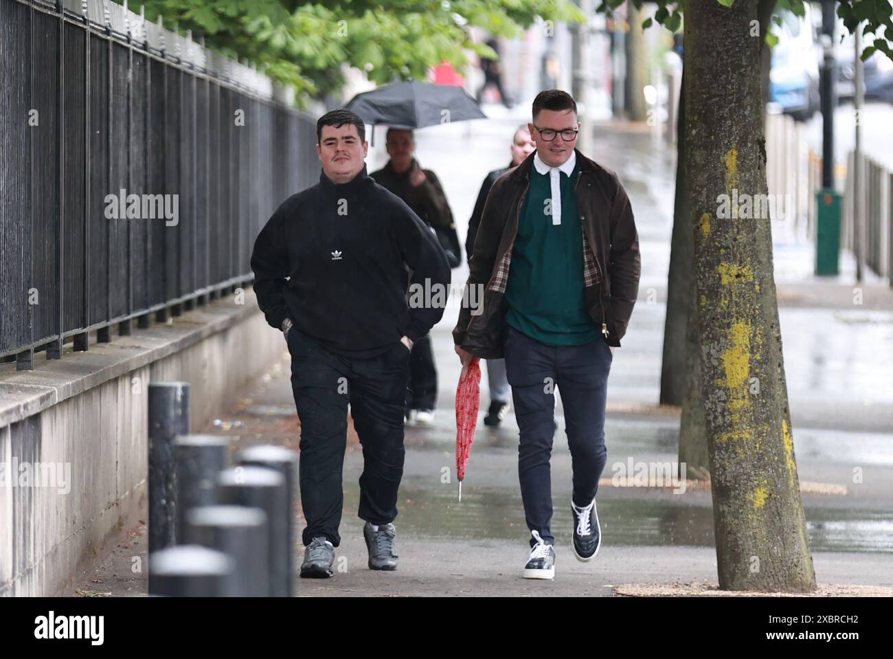 Jordan Devine (left) arrives at Laganside Court, Belfast, where he ...