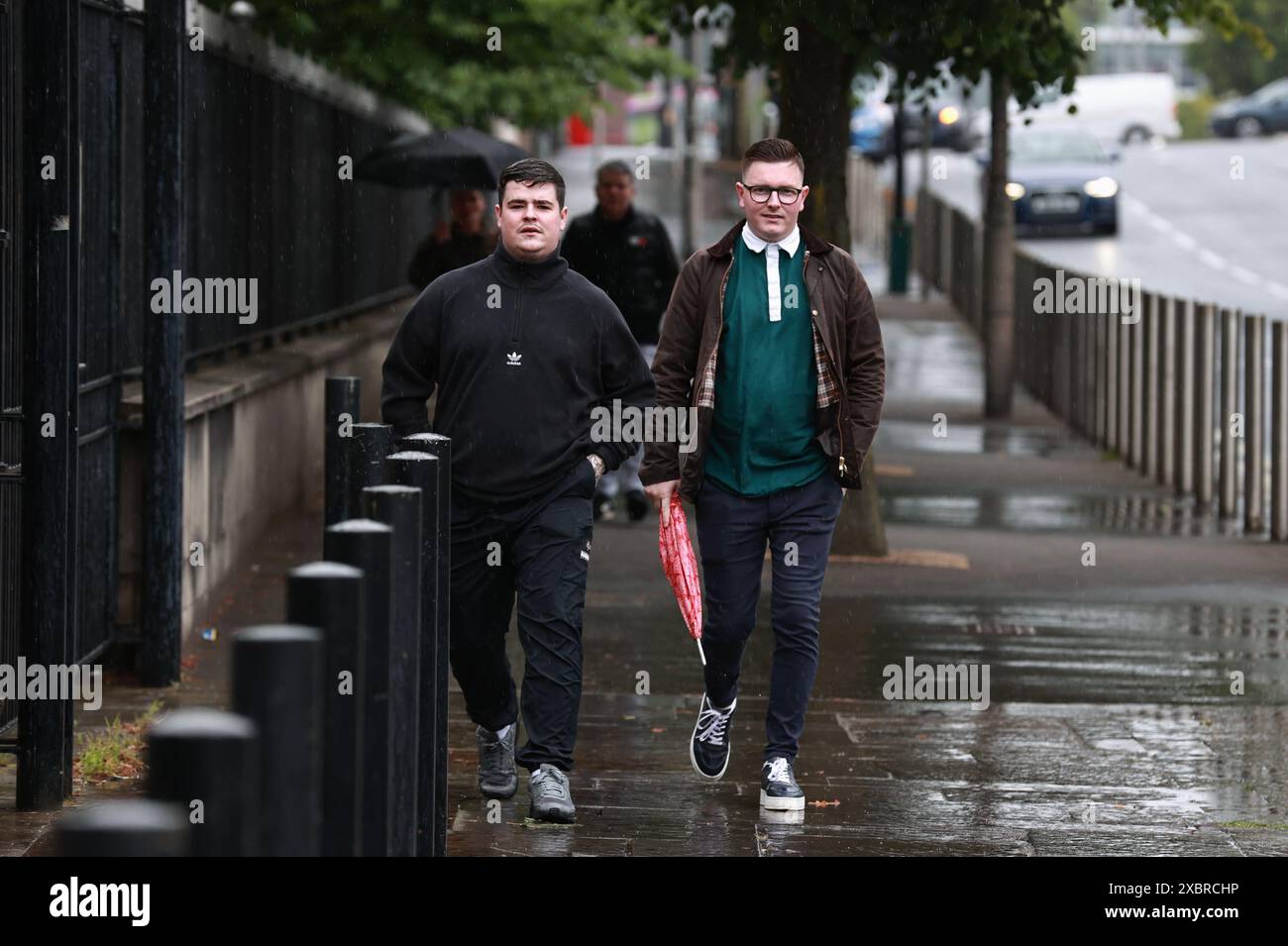 Jordan Devine (left) arrives at Laganside Court, Belfast, where he ...