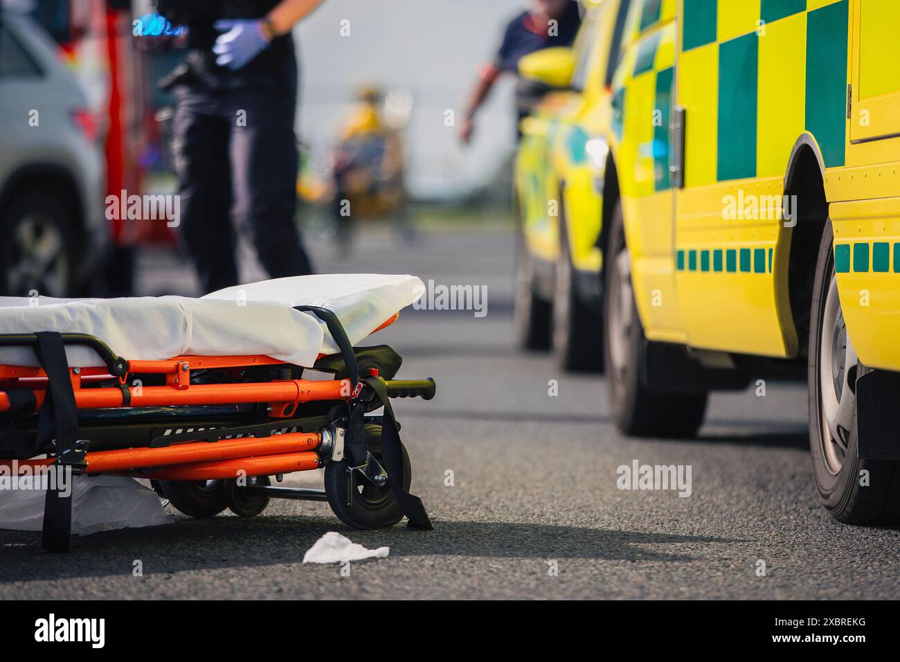 Selective focus on stretcher against ambulance cars of emergency ...