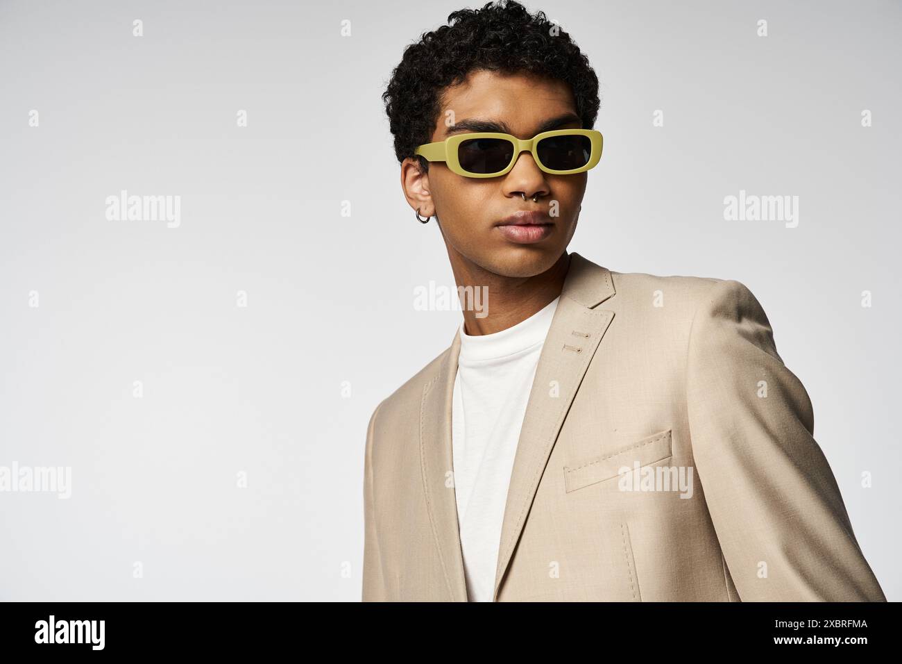 Handsome African American Man In Tan Suit And Yellow Sunglasses Stock