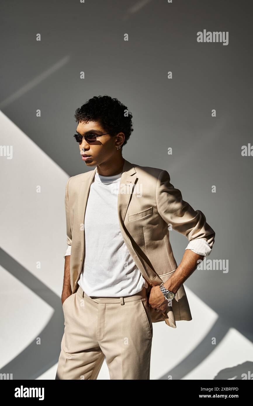 Stylish African American man in tan suit and trendy sunglasses Stock ...