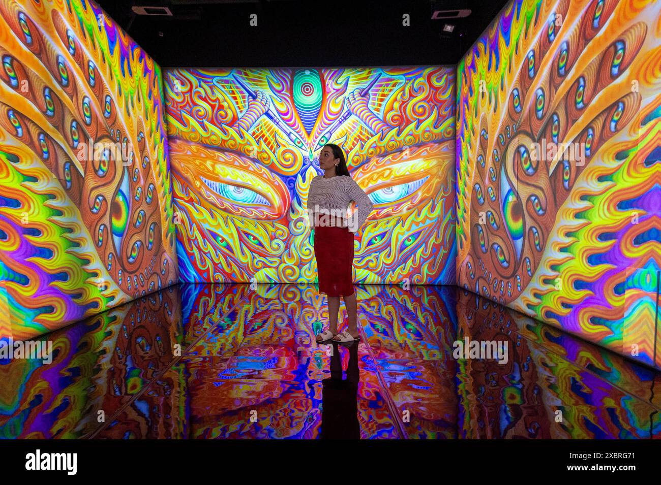 London, UK. 13 June 2024. A staff member in room 1 'Entheon: A Place to ...
