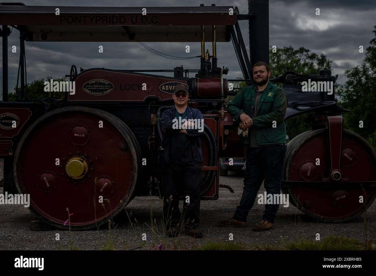 Two men, alongside this steam roller Stock Photo - Alamy