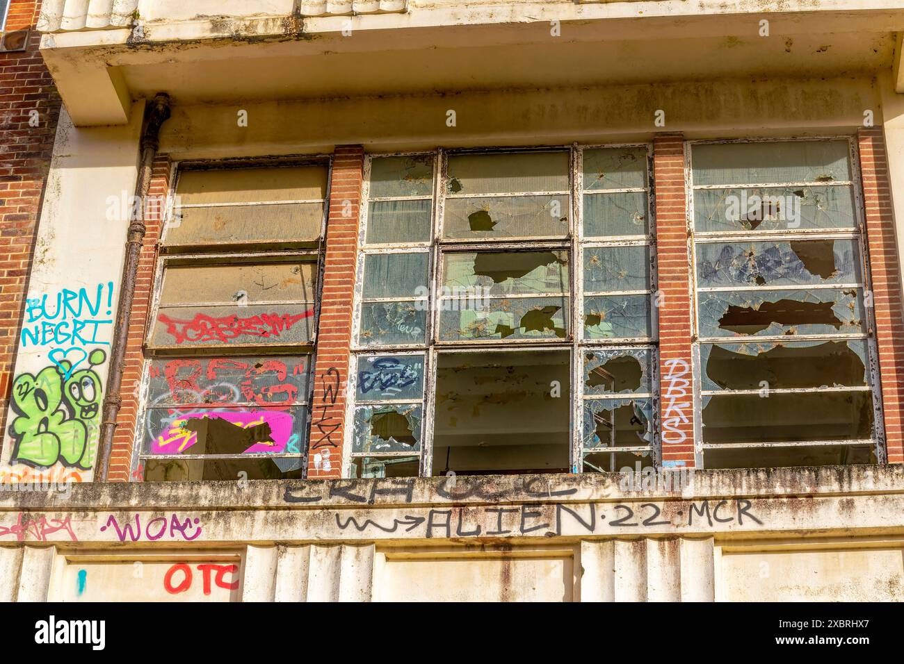 Detail of Smashed Windows, Graffiti Balcony and Interior at Main Brick Building of the Derelict ...