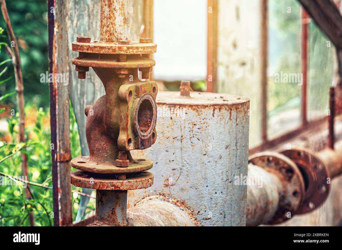 Rusty metal pipe, old water faucet in an abandoned building Stock Photo ...
