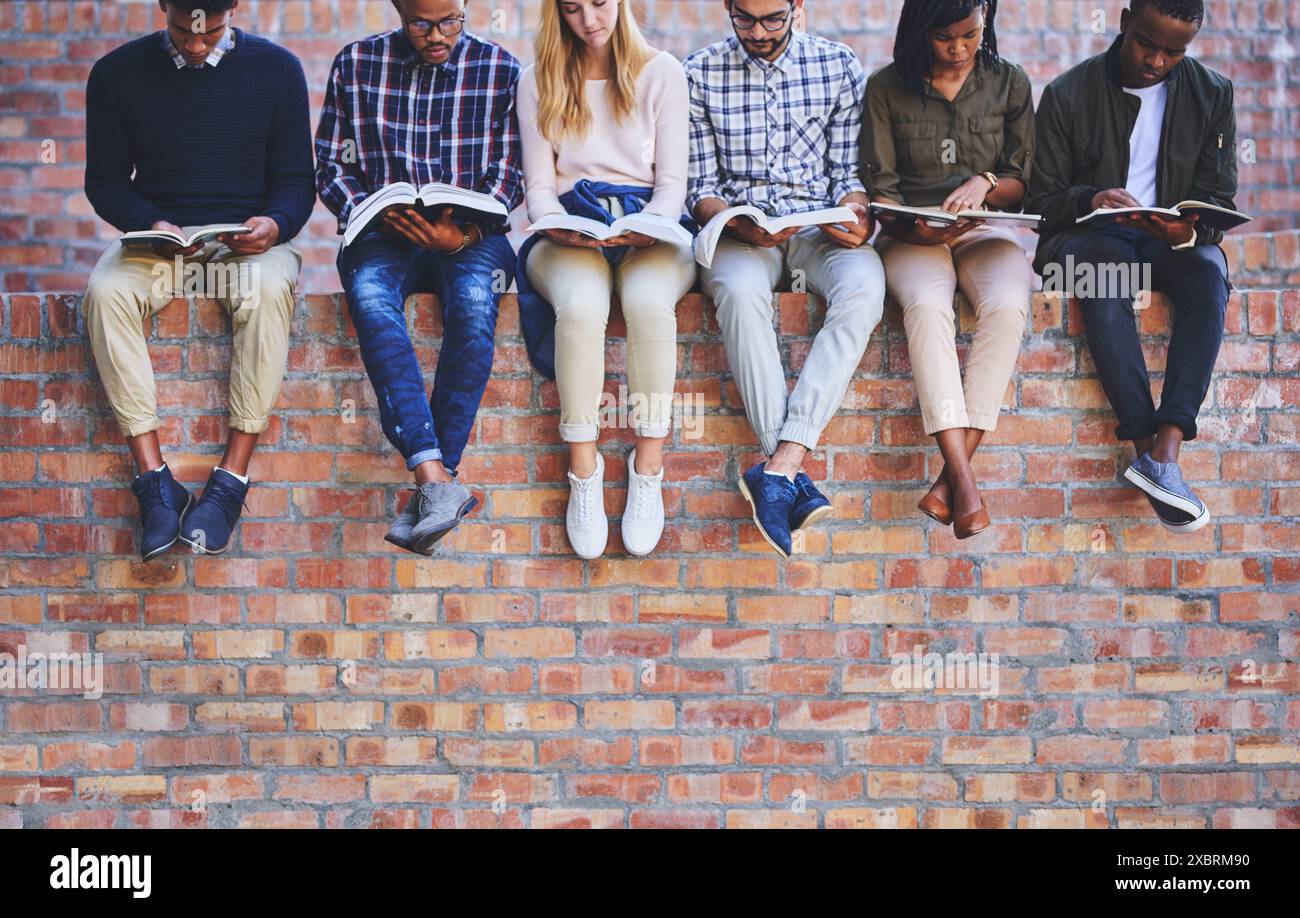 College student, friends and books on wall with legs, learning and ...