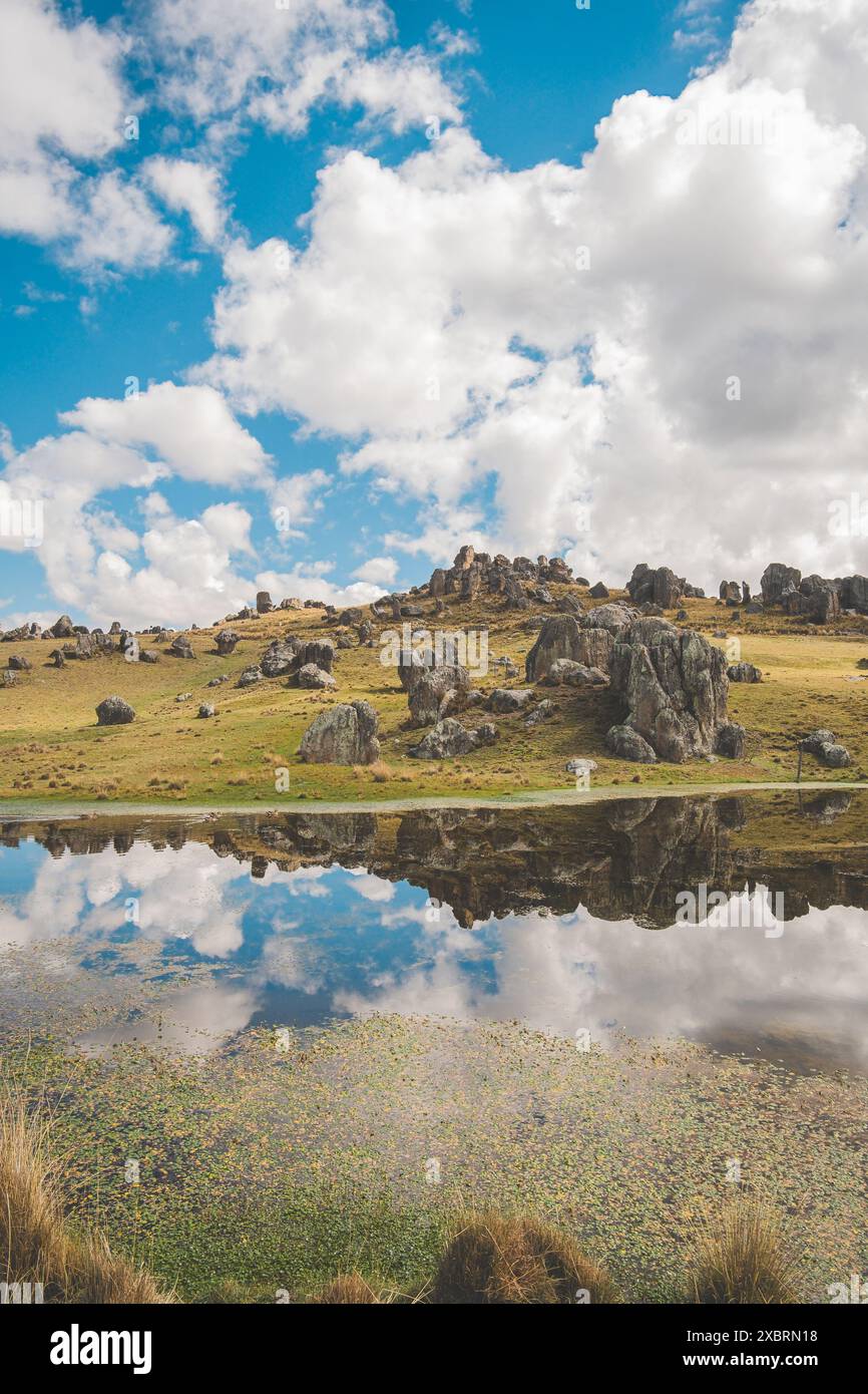 Lake in Huayllay Stone Forest, rocks eroded by the wind over the years ...