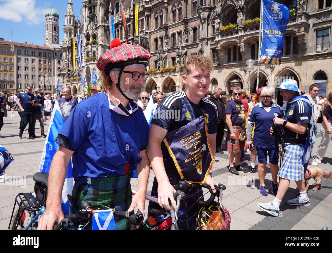 Scotland fan Ethan Walker (right), who has cycled 1,200km to watch his ...