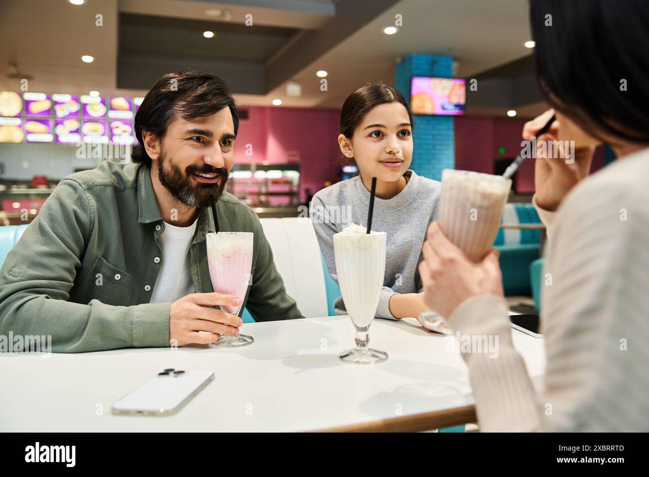 A happy family enjoying quality time together at a modern restaurant ...