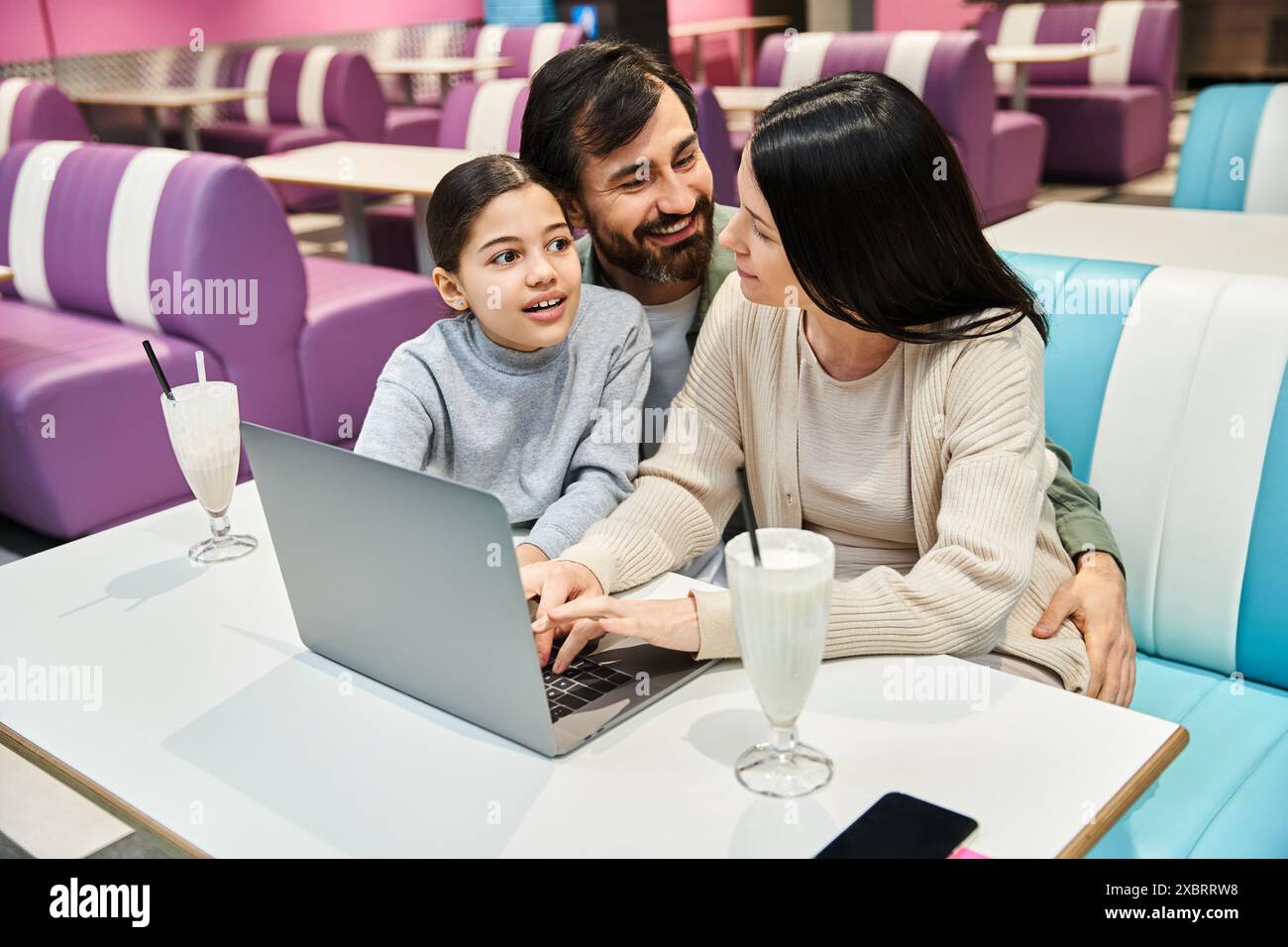 Man woman child gather around hi-res stock photography and images - Alamy