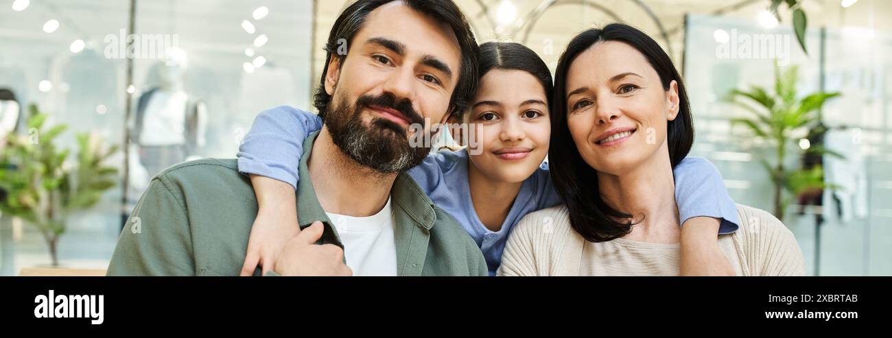 A joyful family poses together in an office setting for a memorable ...