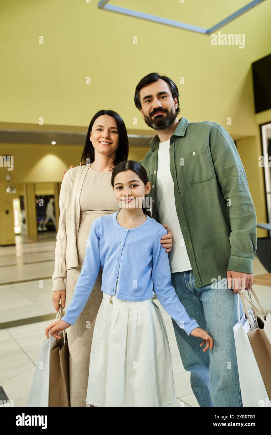 A joyful family with shopping bags leisurely strolling through a ...