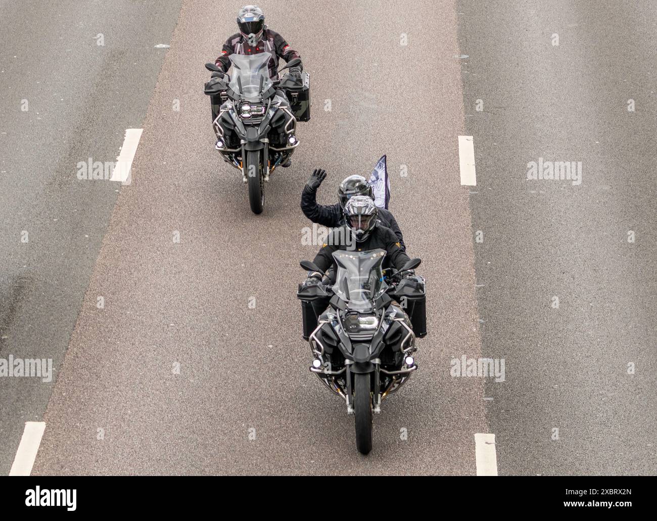 Photo of group of motorbikes in heavy traffic congestion on the M6 ...