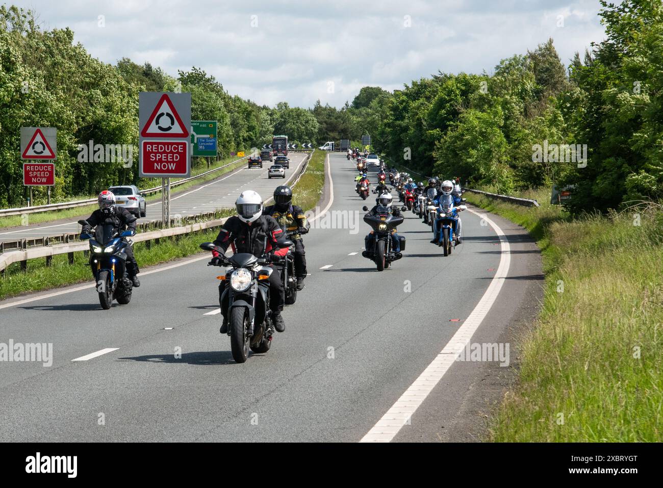 Motorcycles on the "Dave Day" ride on the A591, Cumbria. "Dave Day" saw ...