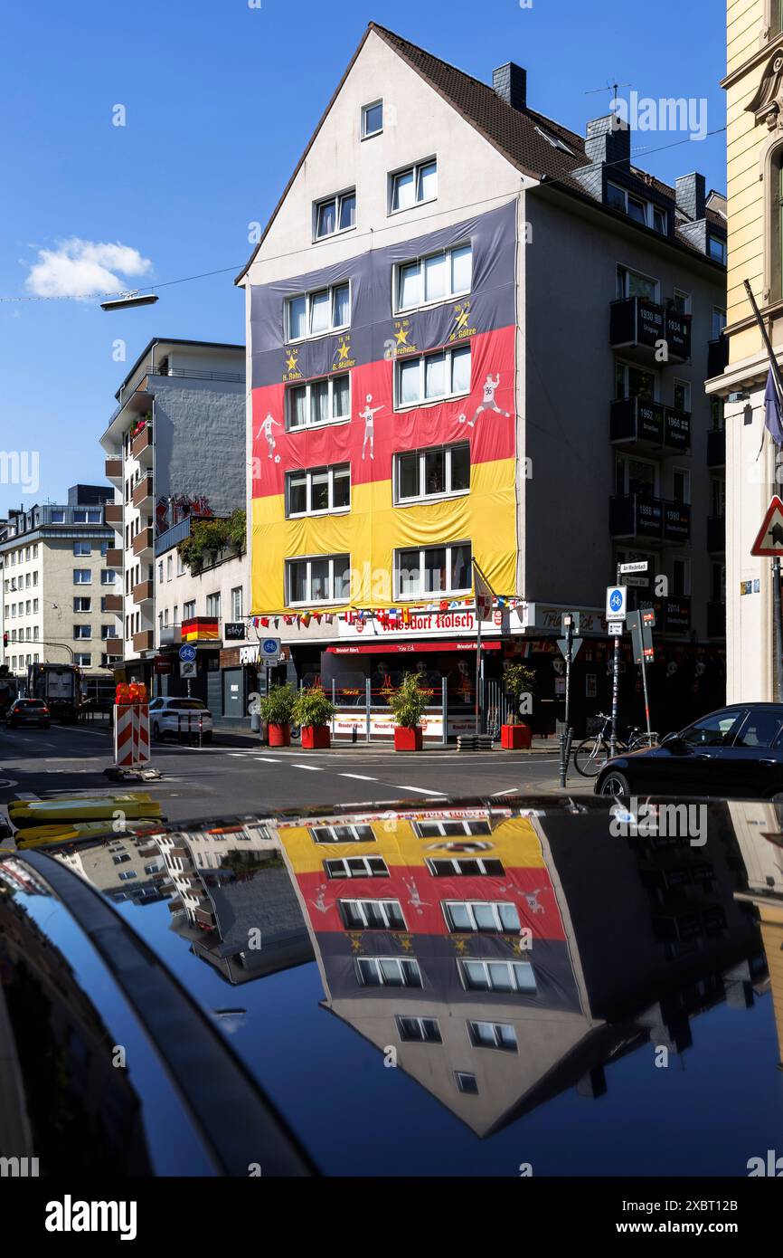 with a huge German flag covered house on the occasion of the UEFA ...