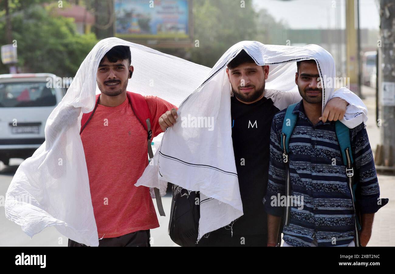 GHAZIABAD, INDIA - JUNE 12: People wrap their face with cloth to get ...