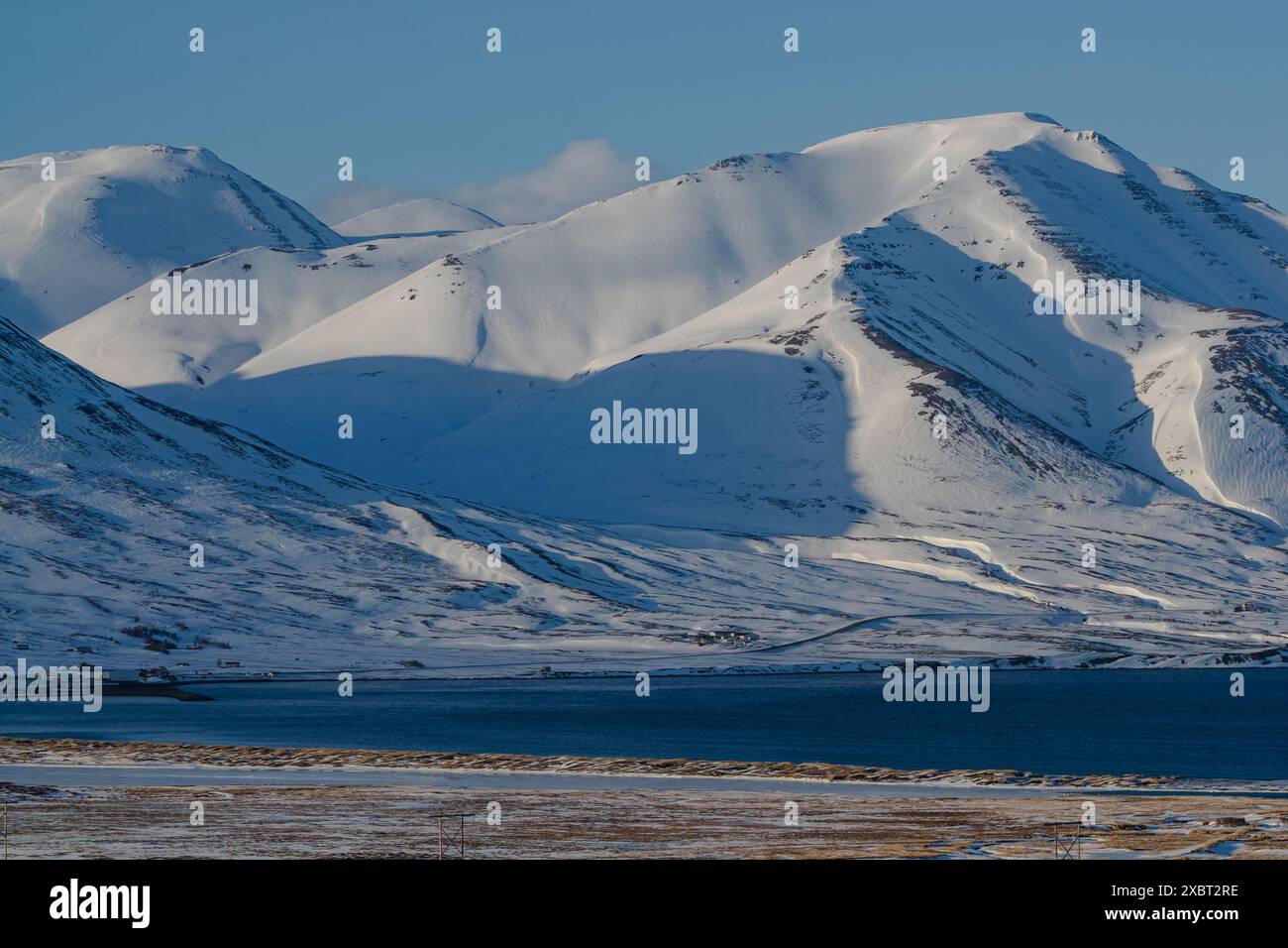Harbor with Snowy Mountain Backdrop Stock Photo - Alamy