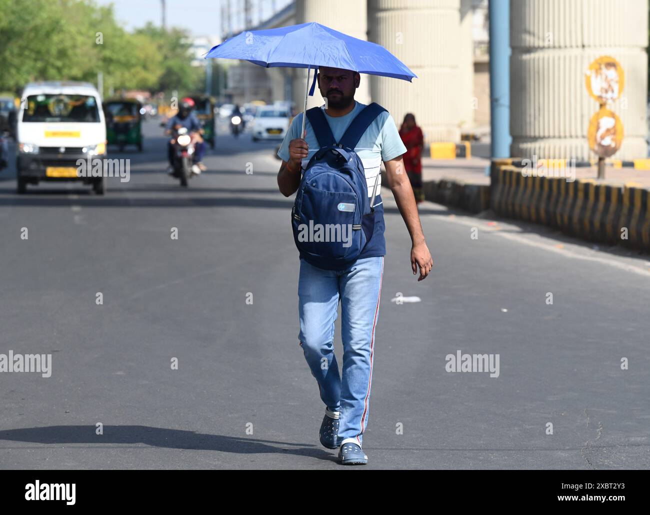 NOIDA, INDIA - JUNE 12: Commuters brave the heat Wave during a hot ...