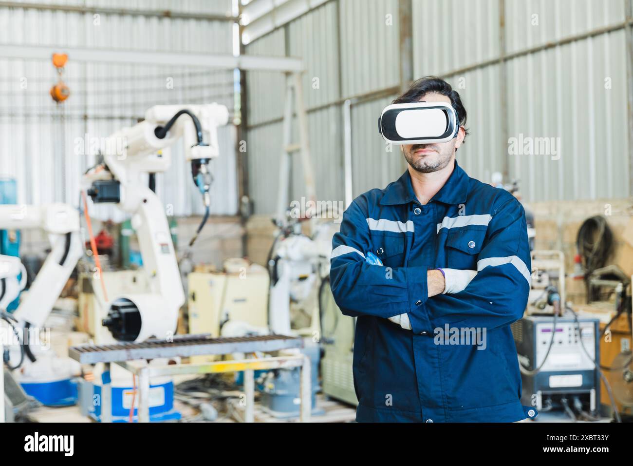 engineer using vr Glasses for controlling the robotic welding arm in ...