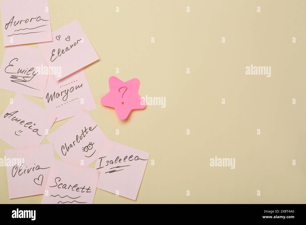 Choosing baby name. Paper stickers with different names and question ...