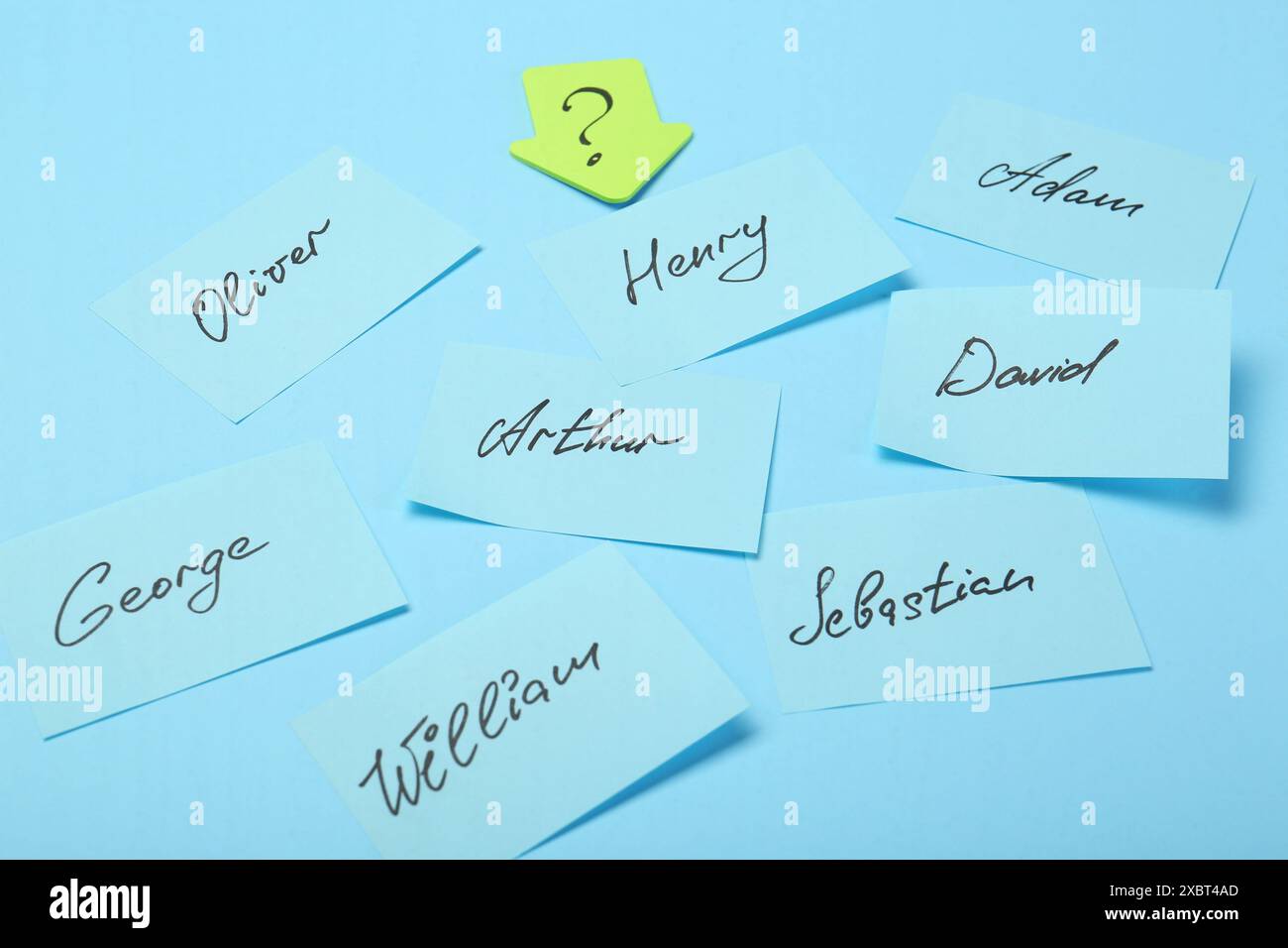 Choosing baby name. Paper stickers with different names and question ...