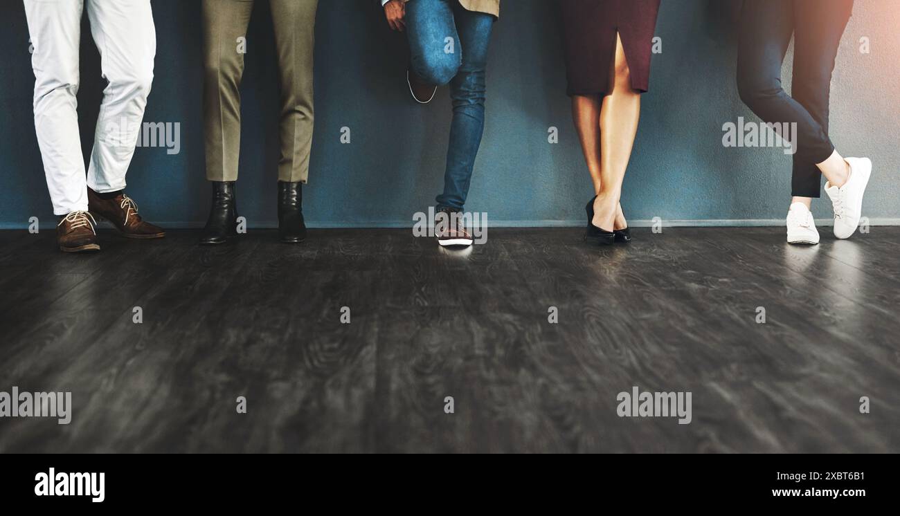 Business, people and office wall with legs, job interview and ...
