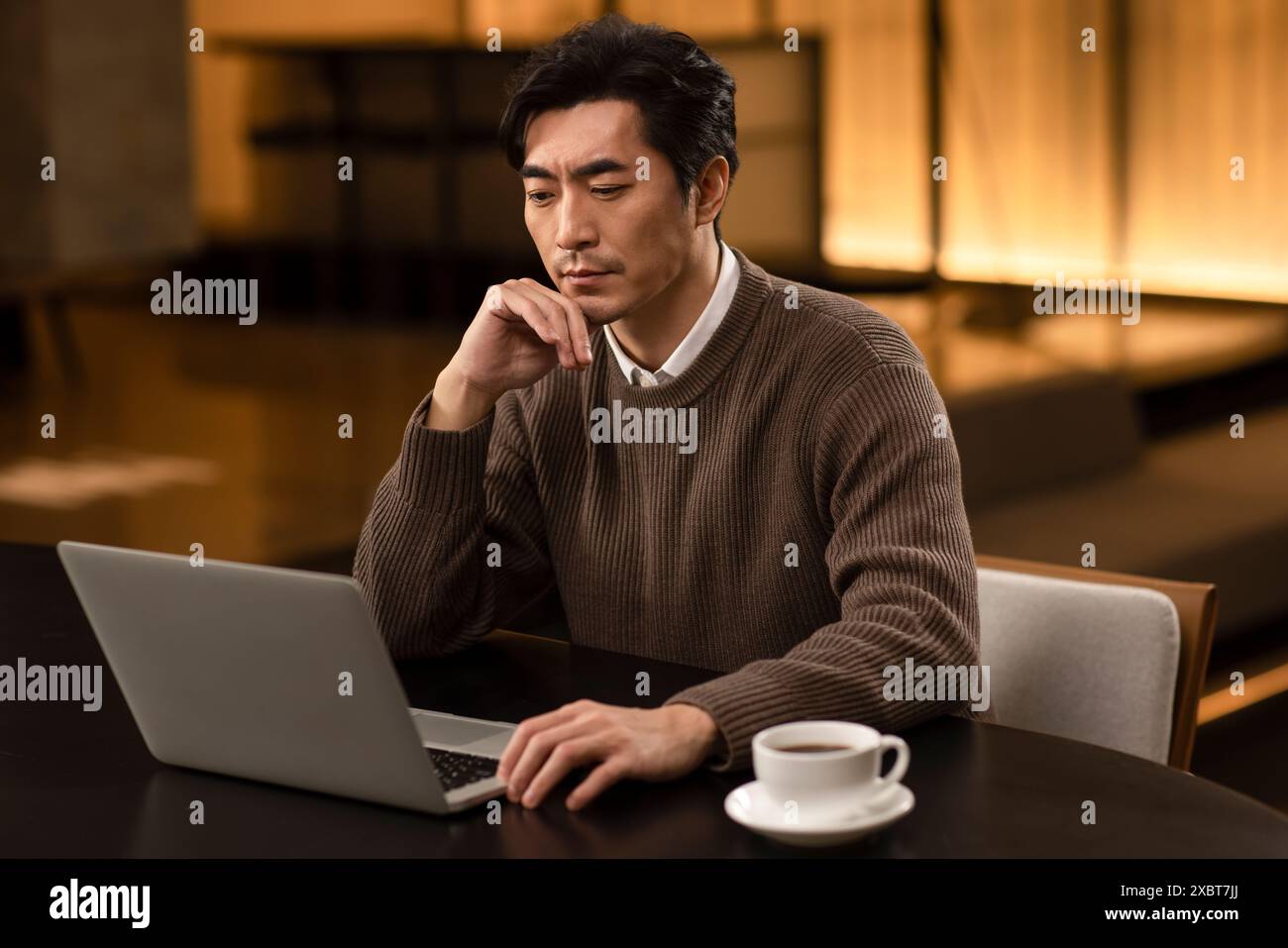 Serious man from east working hi-res stock photography and images - Alamy
