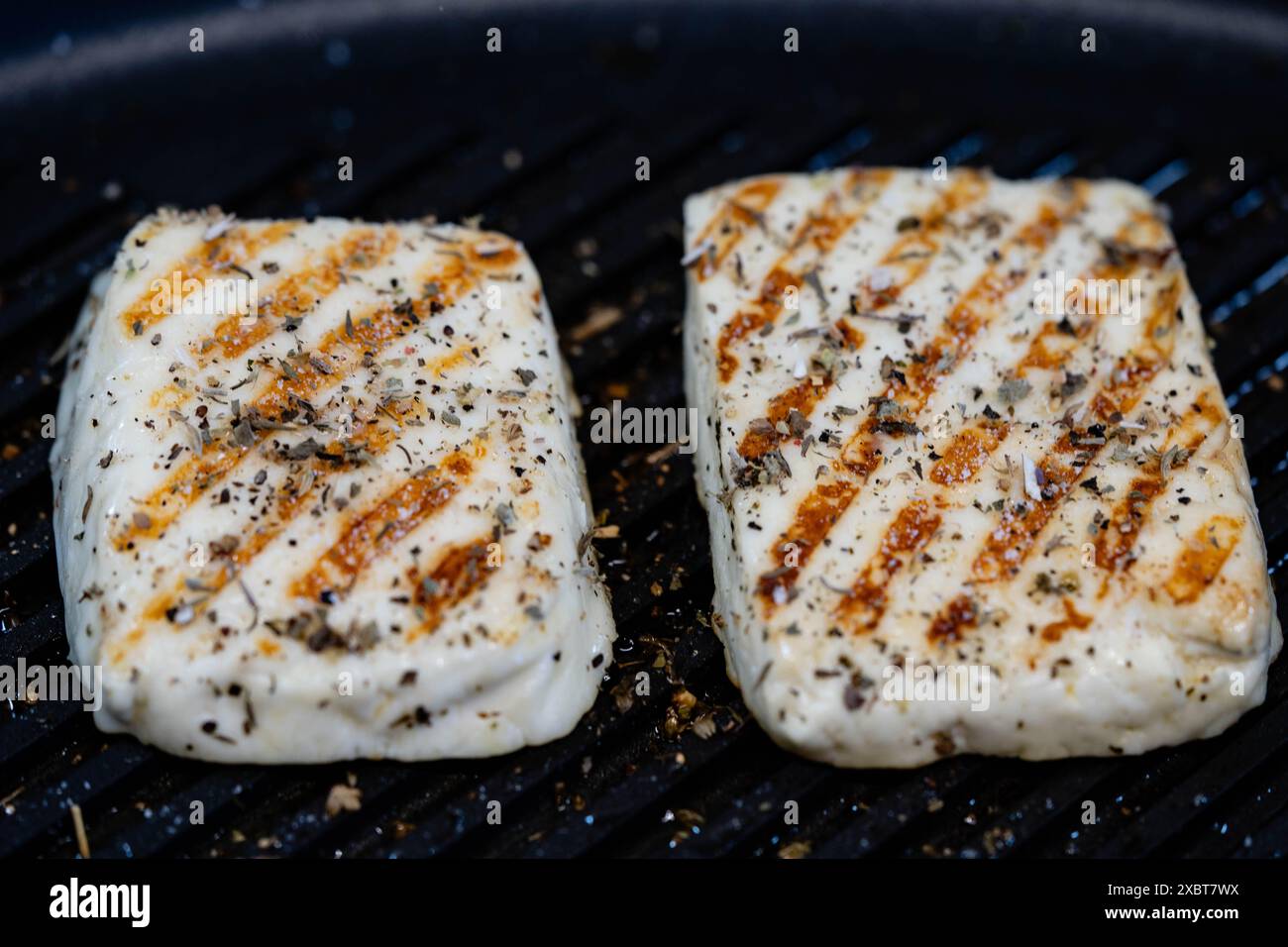 breaded and baked greek sheep's cheese with herbs and spices Stock ...