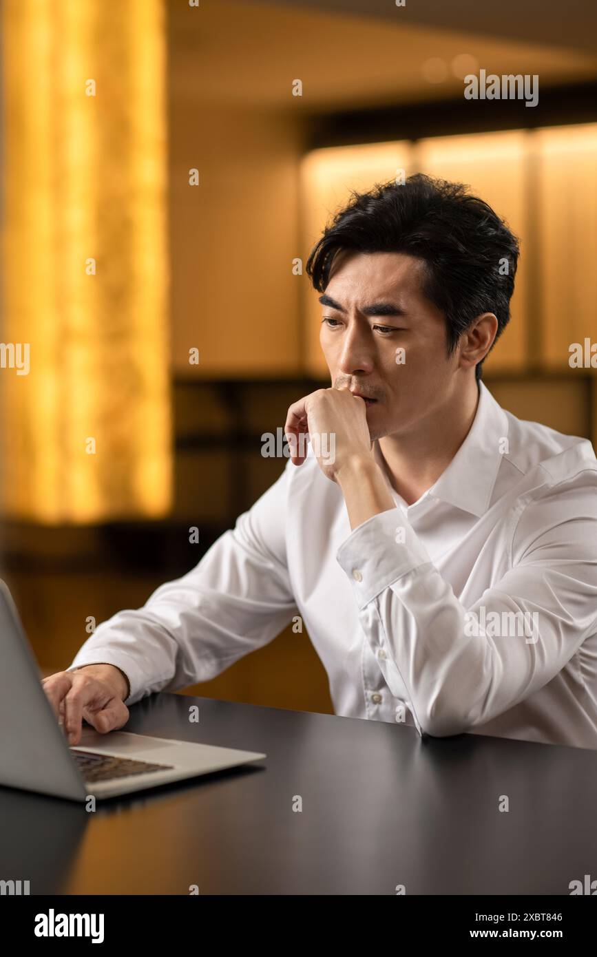 Serious man from east working hi-res stock photography and images - Alamy