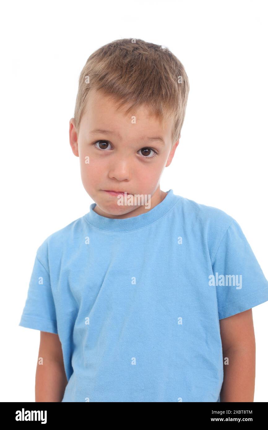 little boy with sorry expression and guilty look on his face on white ...