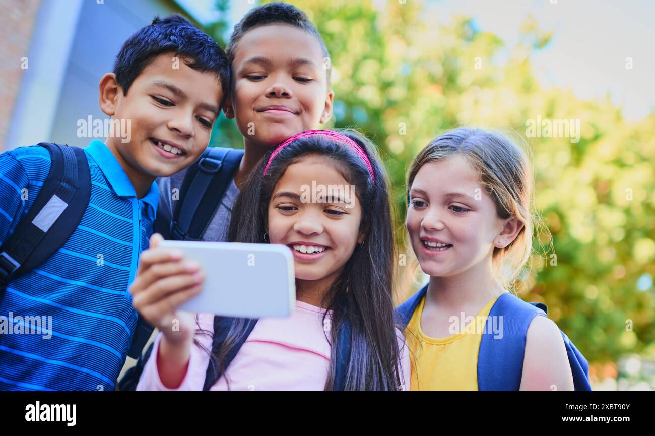School kids, friends and phone for video, outdoor and happy with ...