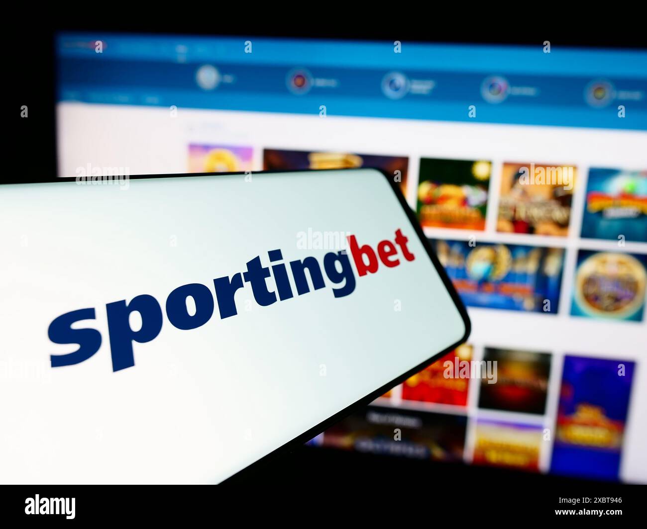 Mobile phone with logo of British sports betting company Sportingbet ...