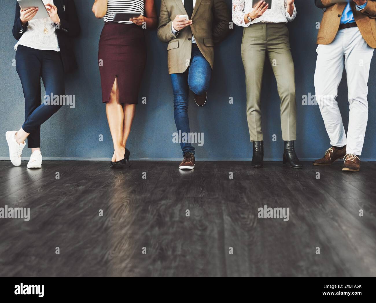 Business, people and office wall with legs, job interview and ...