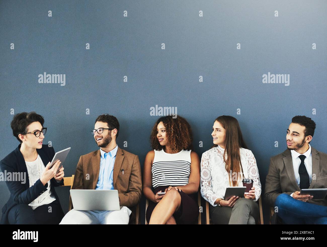 Business, coworkers and office queue with devices, connection and tech ...