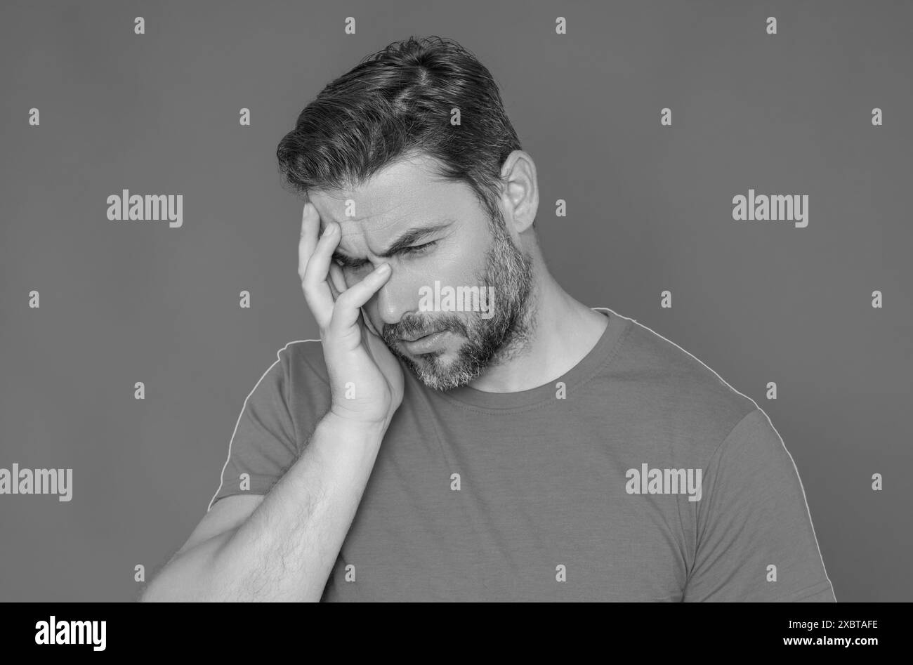 Thinking concept. Portrait of focused smart and creative man, holding ...