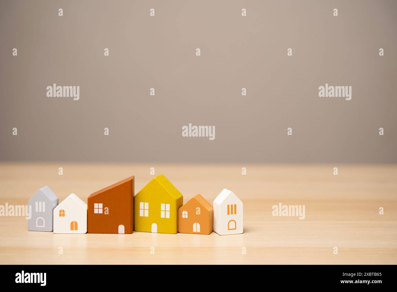 Wooden houses stand in a row. Real estate, affordable housing concept ...