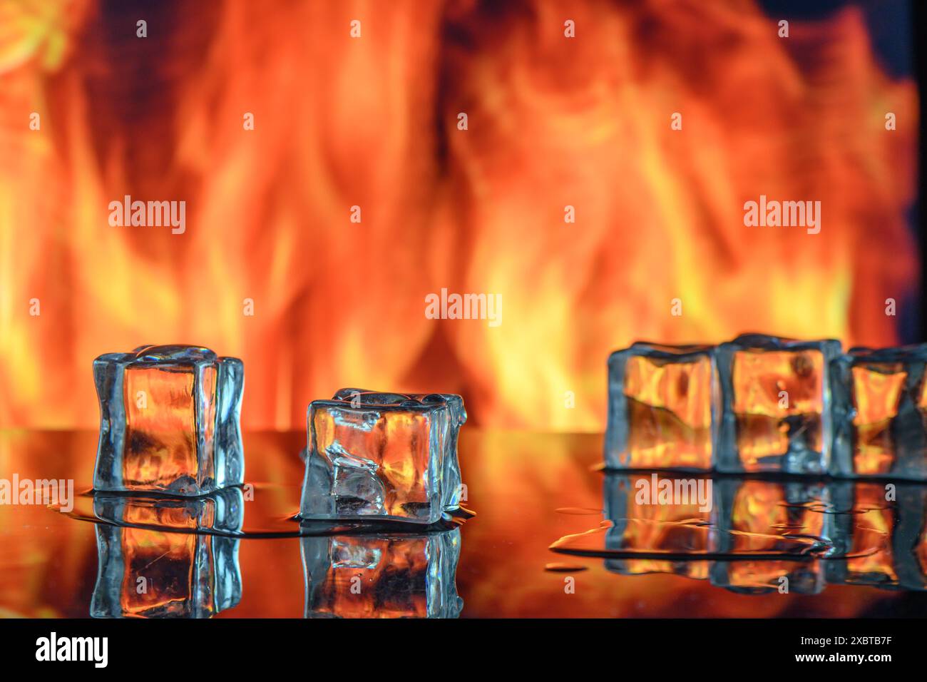 cubes of ice and fire on a water surface on an abstract background 1 ...
