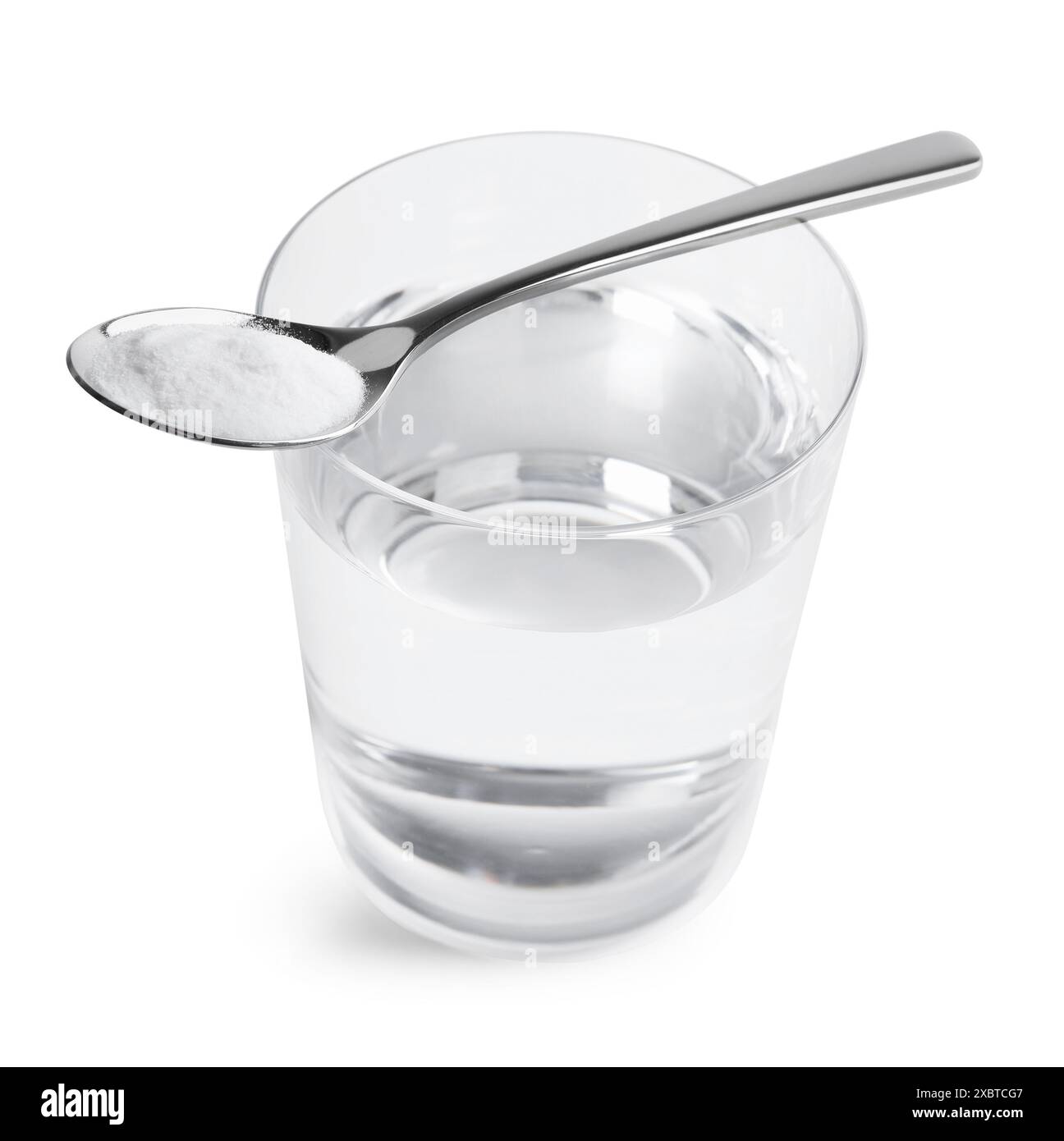 Glass of water and spoon with baking soda on light background Stock ...