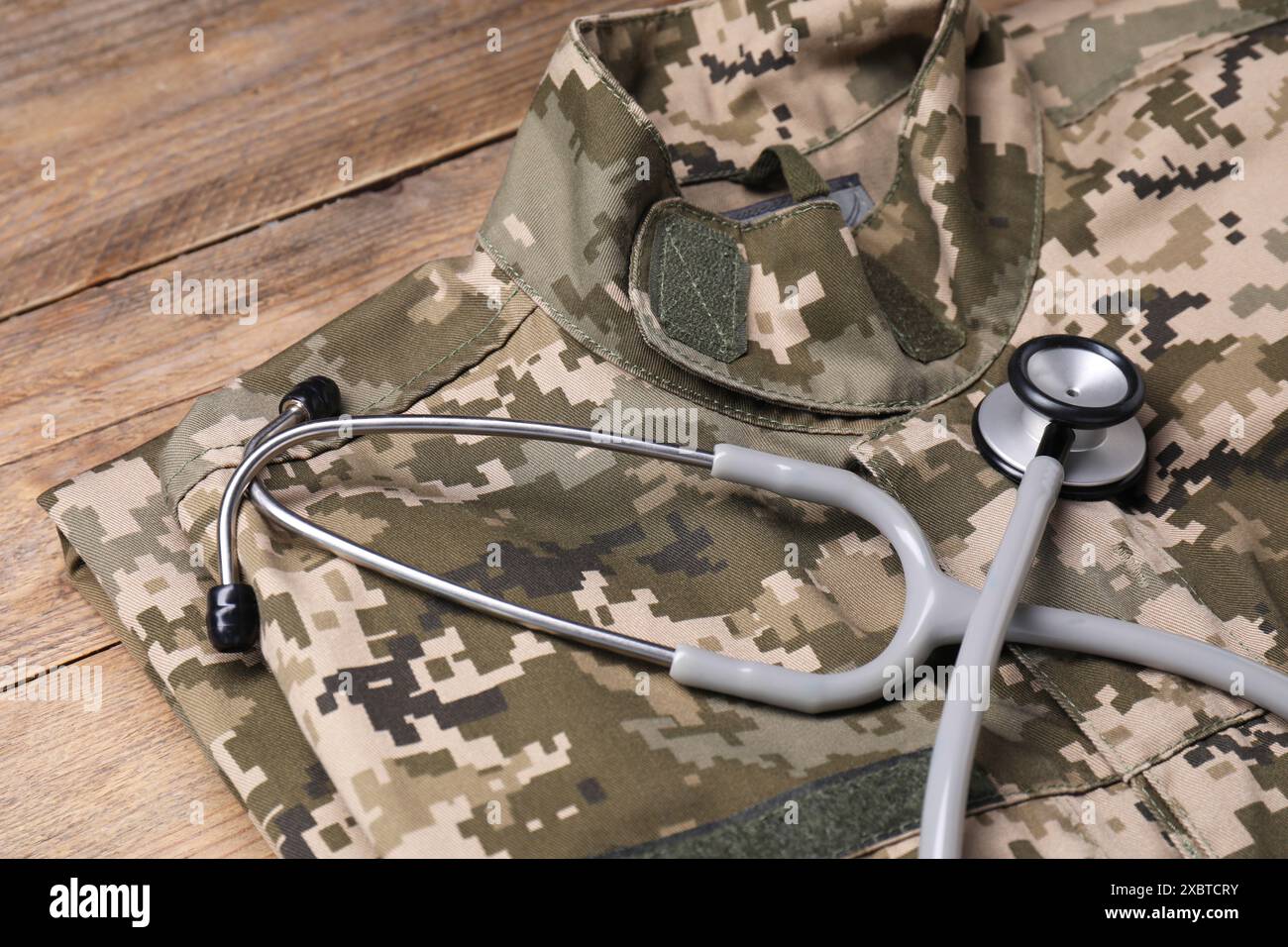 Stethoscope and military uniform on wooden table Stock Photo - Alamy