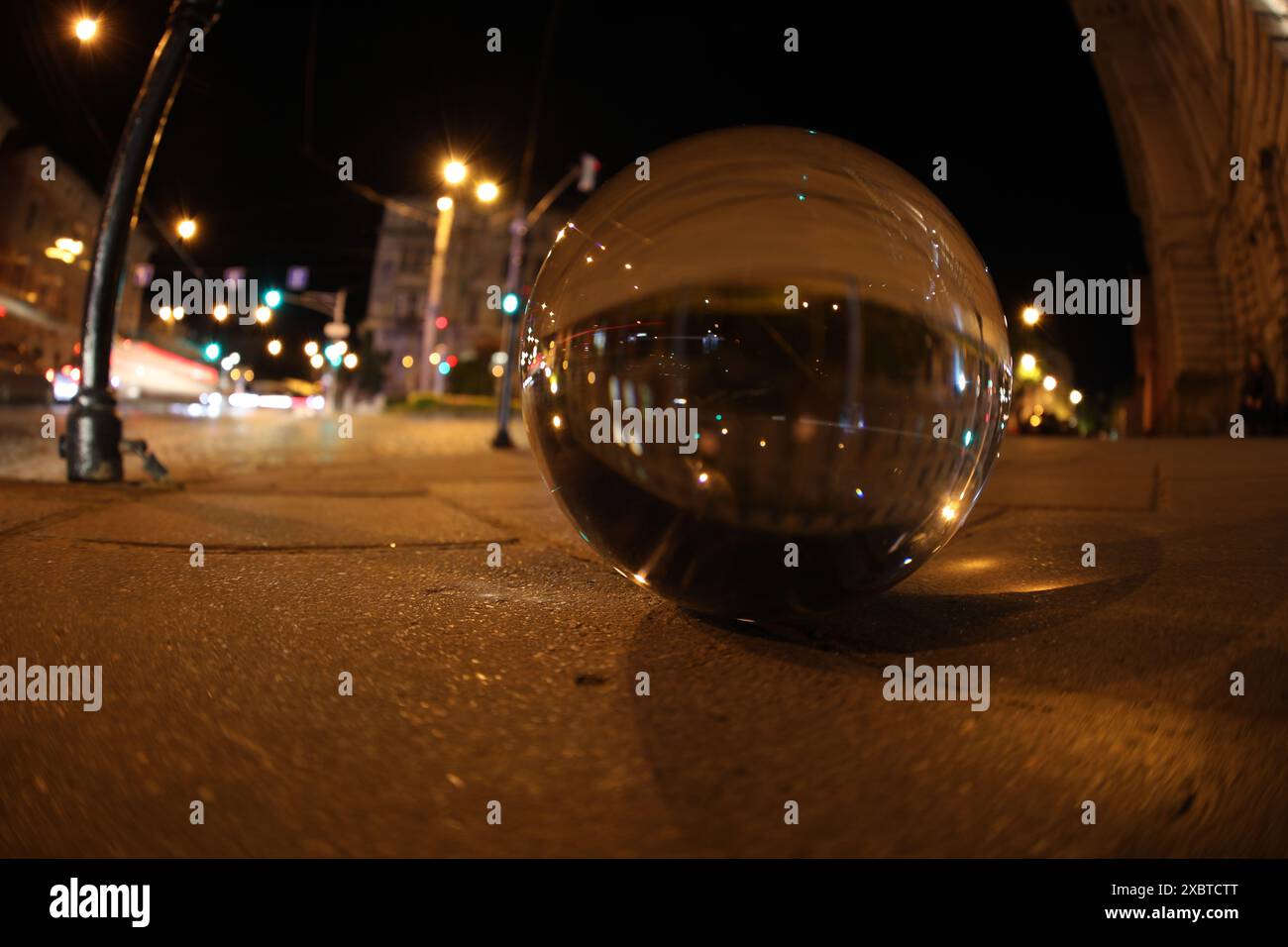 Crystal ball on asphalt road at night. Wide-angle lens Stock Photo - Alamy
