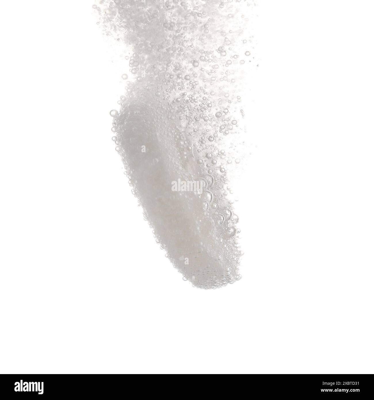 Effervescent pill dissolving in water on white background, closeup ...