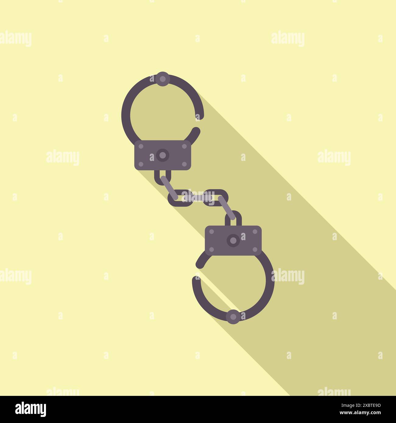 Pair of metal handcuffs with chain casting a long shadow are lying on ...