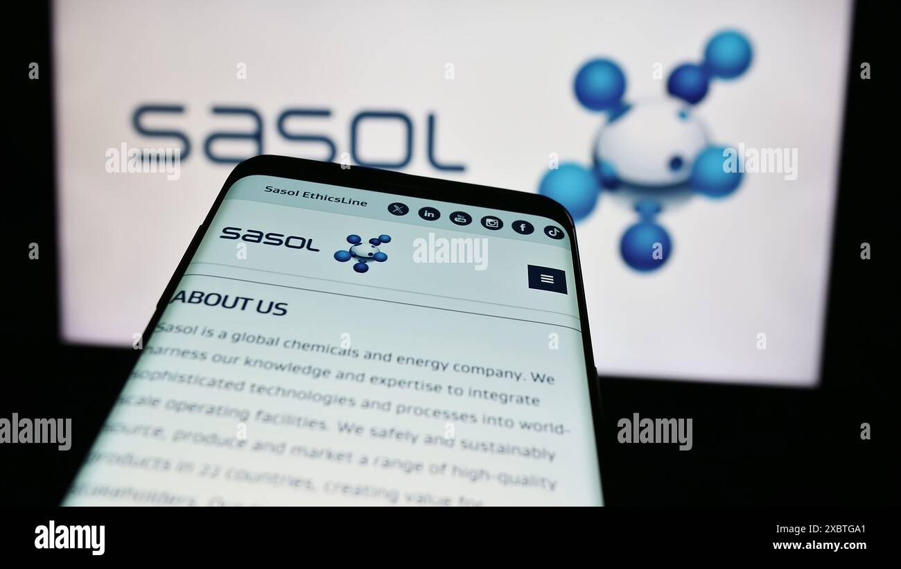 Mobile phone with webpage of South African energy company Sasol Limited ...