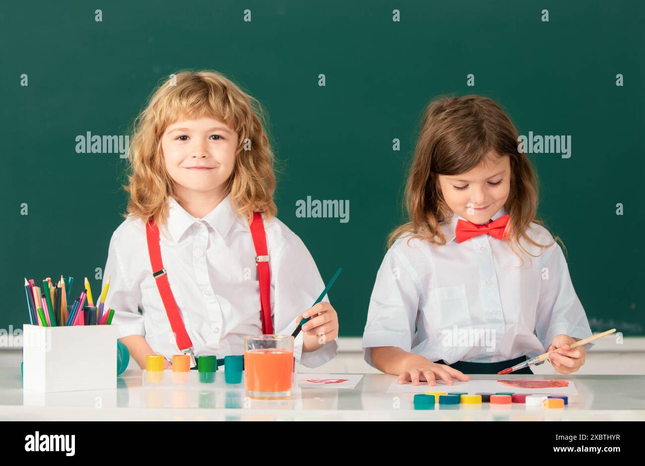 Portrait school kids doing art homework. Children drawing on elementary ...