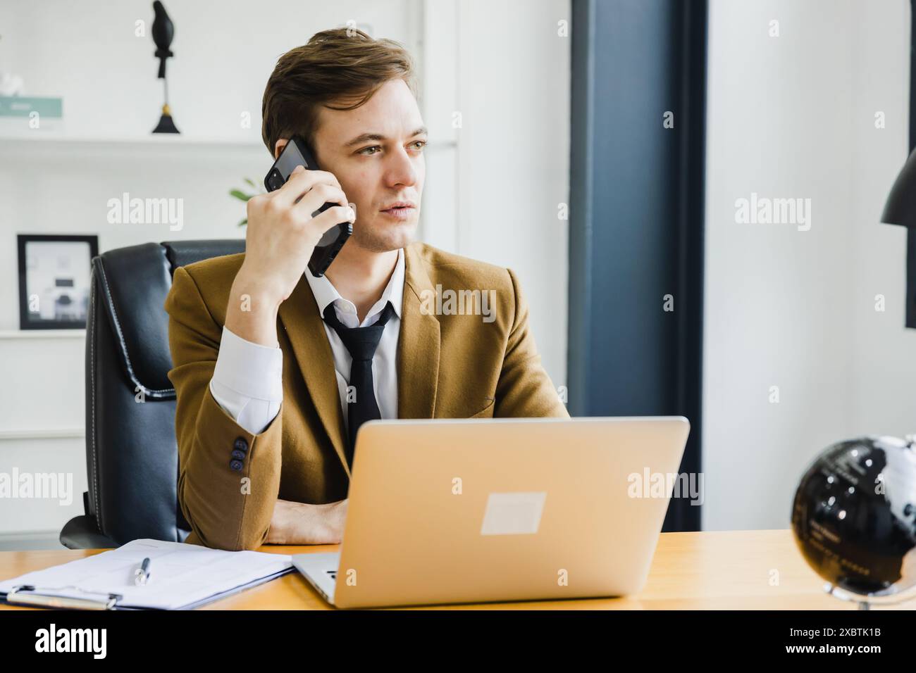Business portrait - businessman sitting in in office working with ...
