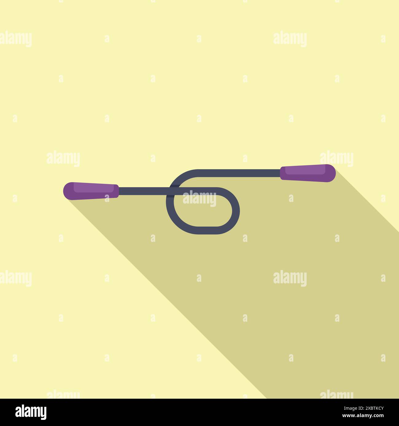 Jump rope lying on the ground casting a long shadow over a yellow ...