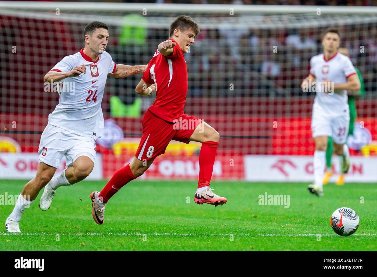 Bartosz Slisz (L) of Poland and Arda Guler (R) of Turkey are seen in ...