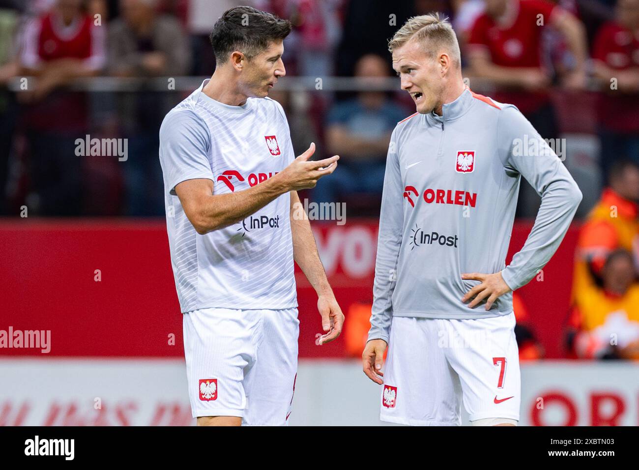 Robert Lewandowski (L) and Karol Swiderski (R) of Poland are seen ...