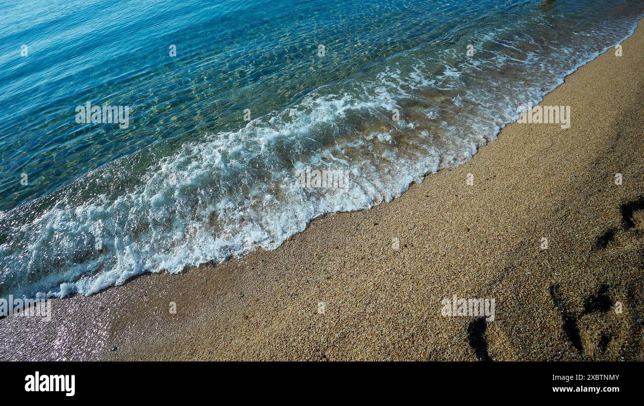 A strip of sea surf and coastal sand. Close- up, background Stock Photo ...
