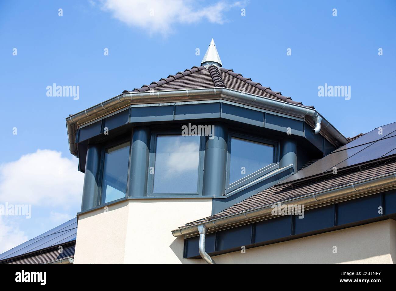 Strikingly beautiful roof construction with round dormer Stock Photo ...